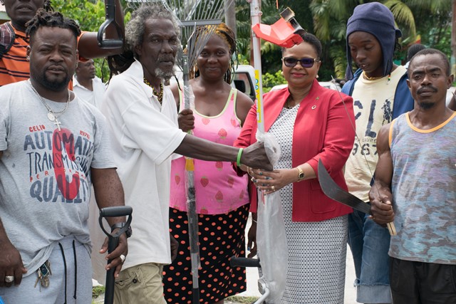 Minister of Health donates tools to Rasville residents to aid in clean ...